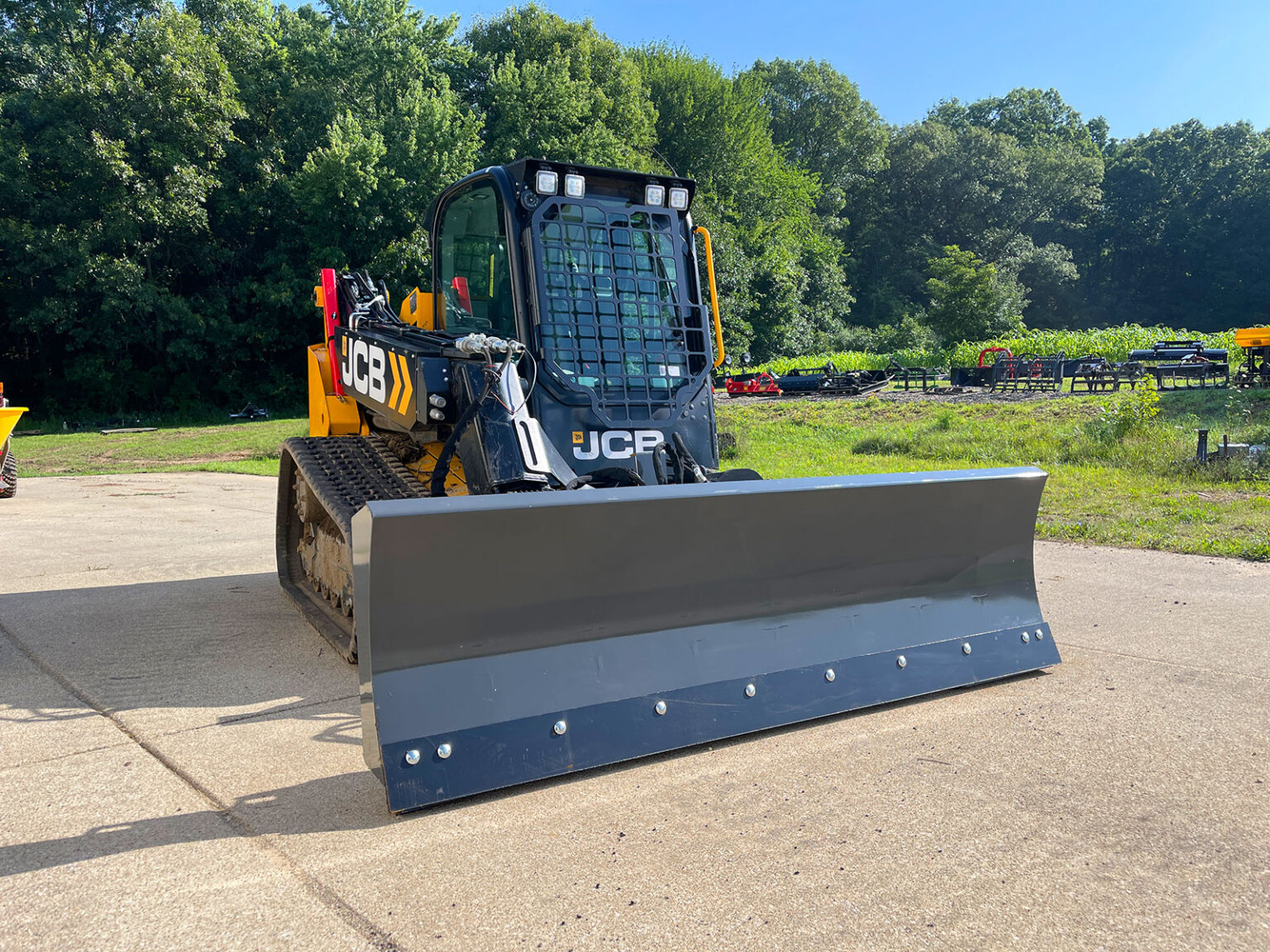 4-Way & 6-Way Articulating Dozer Blade for Skid Steers | IronCraft
